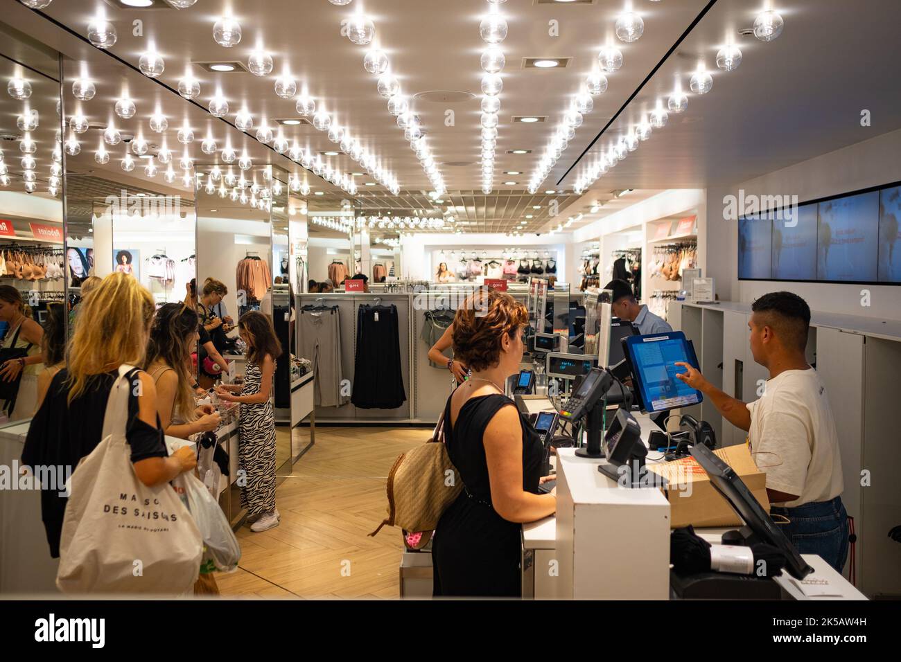 People seen shopping inside a clothing store in the city downtown and ...