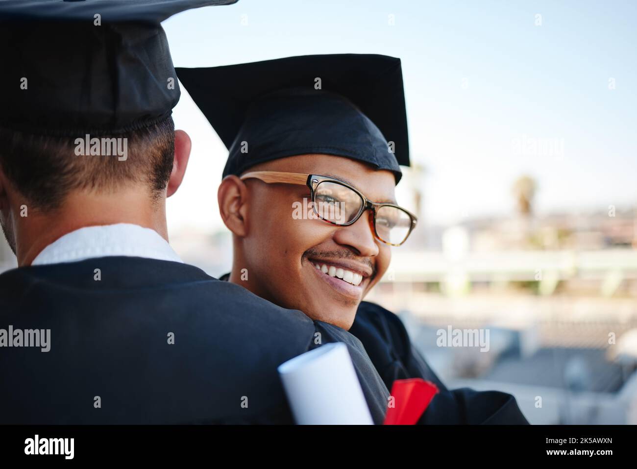 Happy, graduation and college graduate hug with happiness and ...