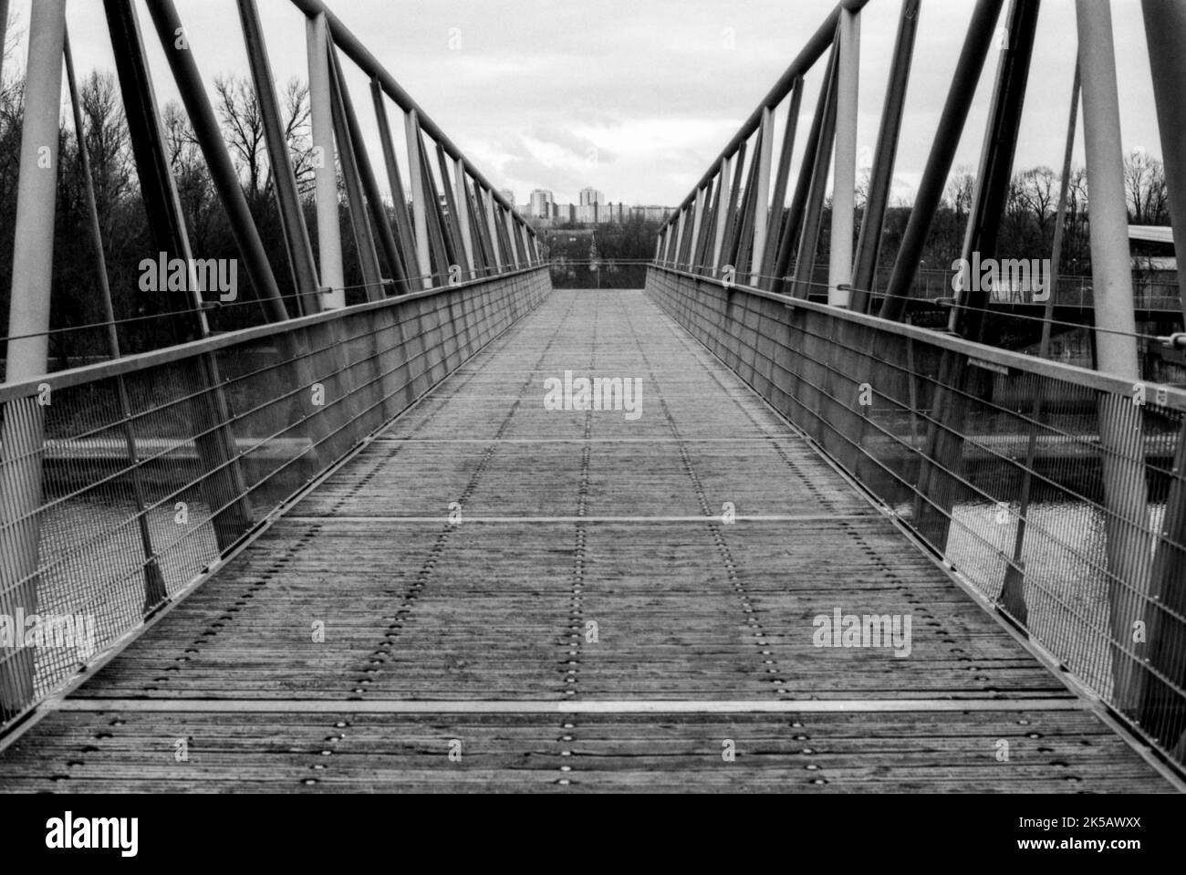 A grayscale shot of a bridge over the river Stock Photo - Alamy