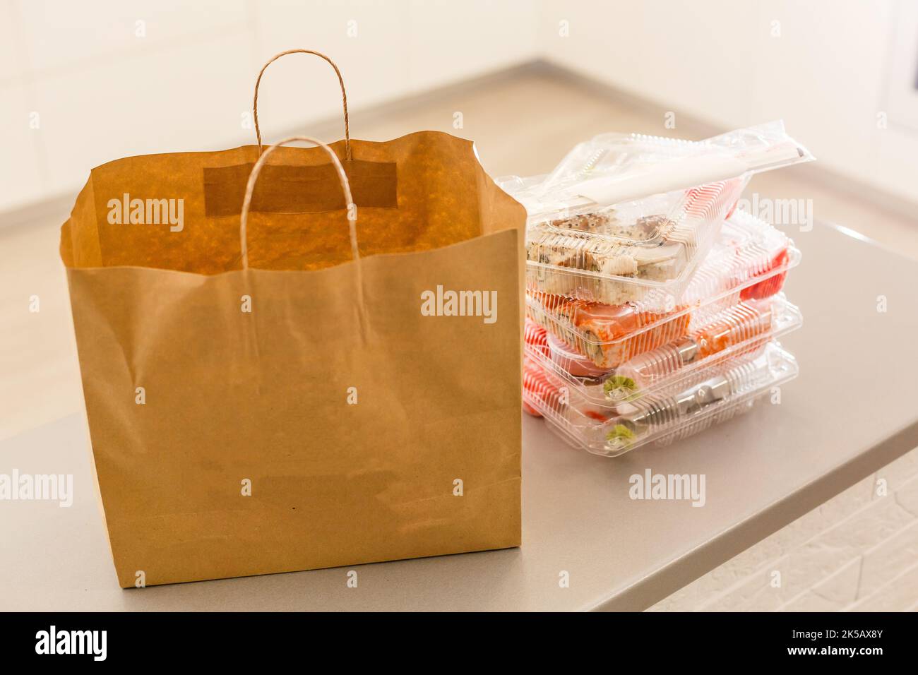 Paper bag on the kitchen table Stock Photo - Alamy