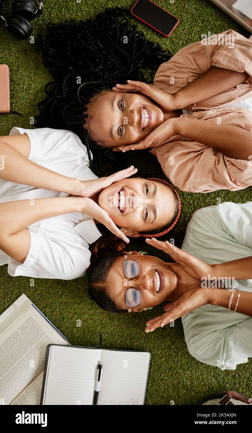 Students, studying and diversity with happy young women lying together ...