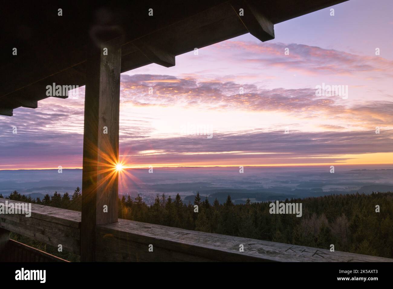A scenic sunset seen from a lookout tower Stock Photo - Alamy