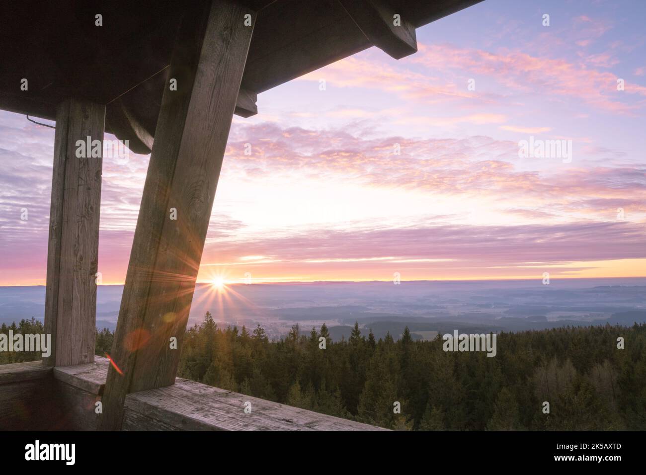 A scenic sunset seen from a lookout tower Stock Photo - Alamy