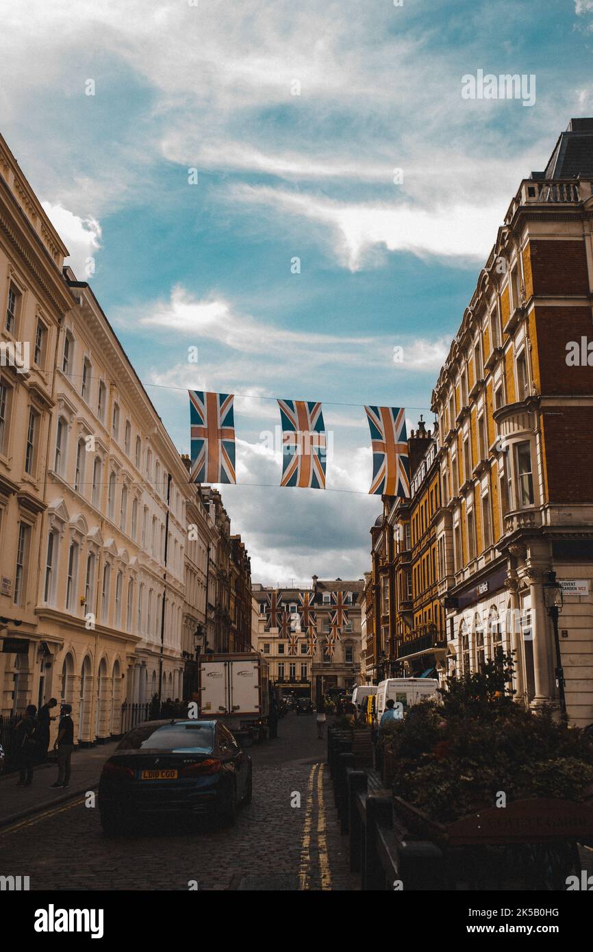 A vertical shot of the British flags in a street in London Stock Photo ...