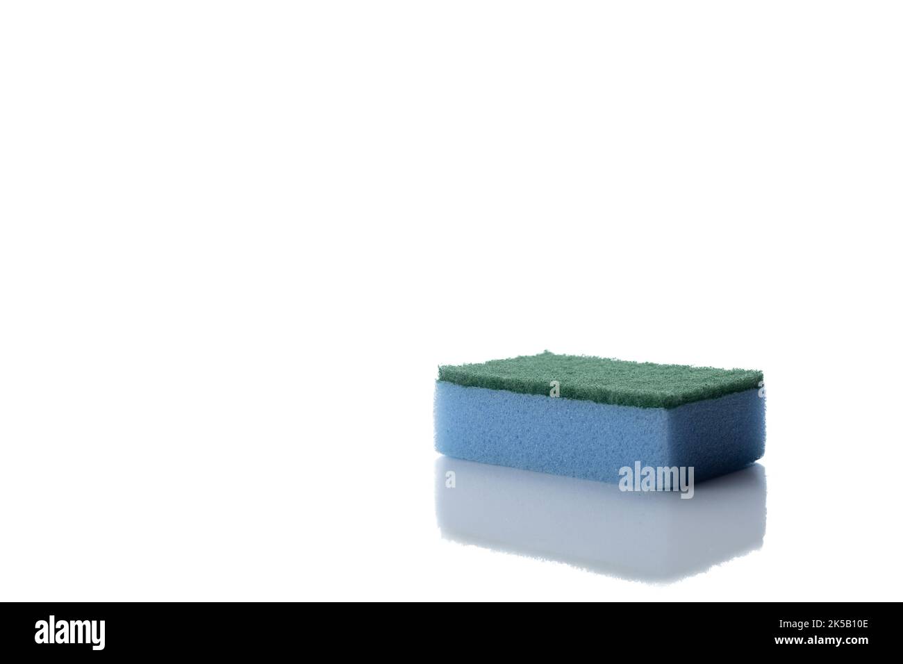 A blue sponge for dish washing isolated in the white background Stock ...