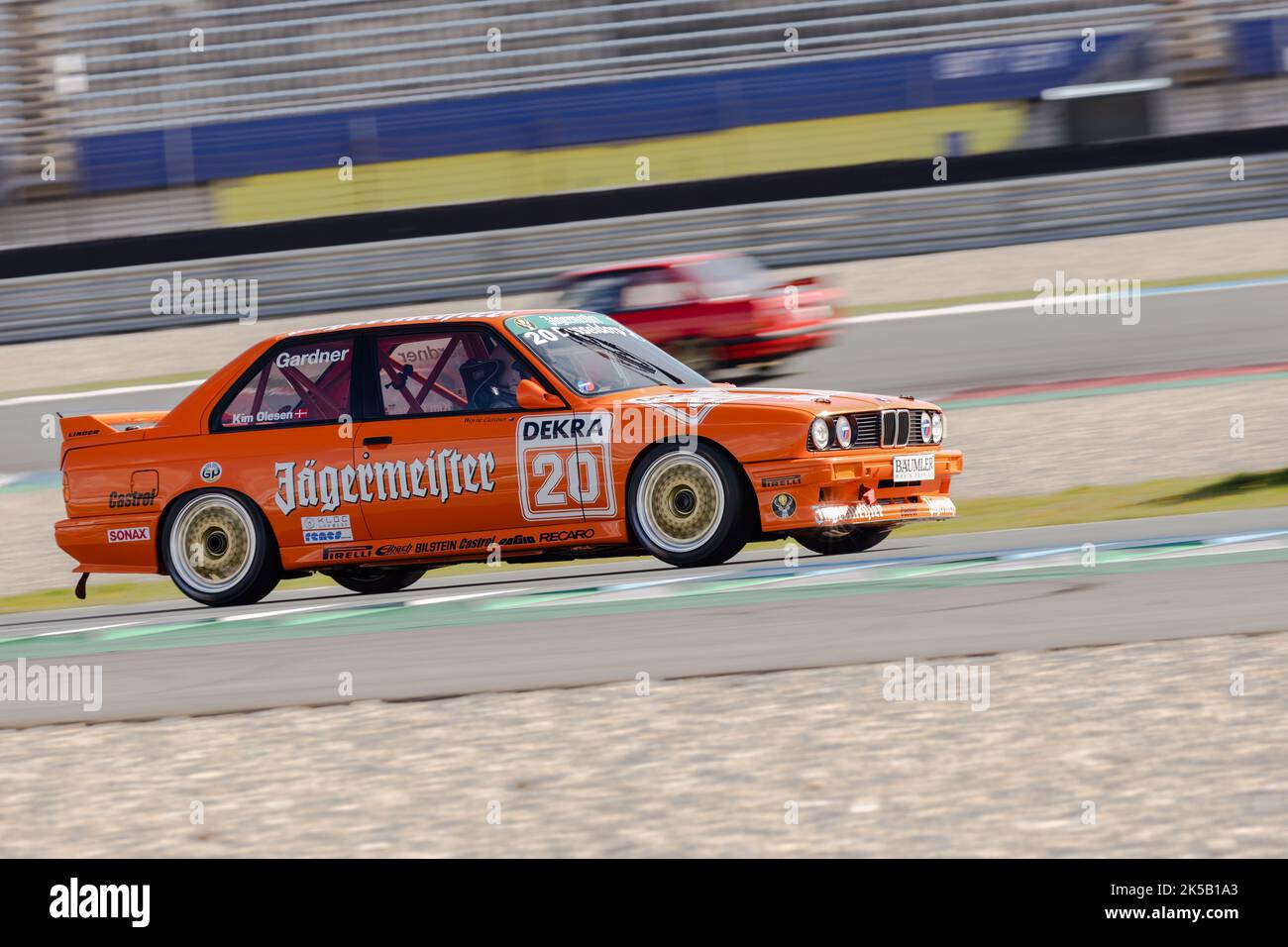 An orange classic car at the TT Circuit Assen circuit Stock Photo - Alamy