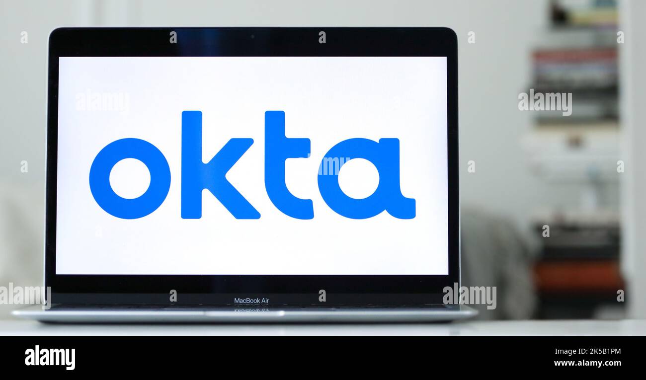 A laptop displaying the logo of Okta company Stock Photo - Alamy