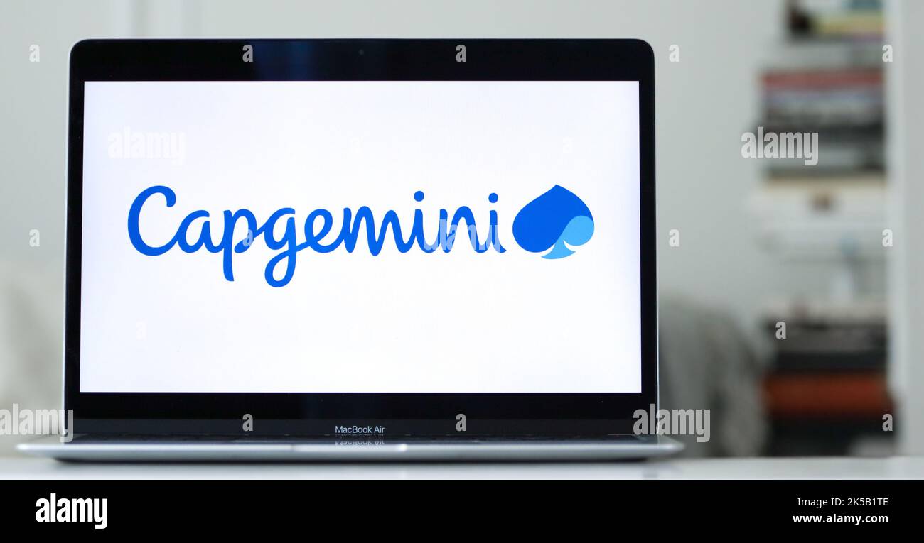 A laptop displays the logo of Capgemini, a technology company Stock ...