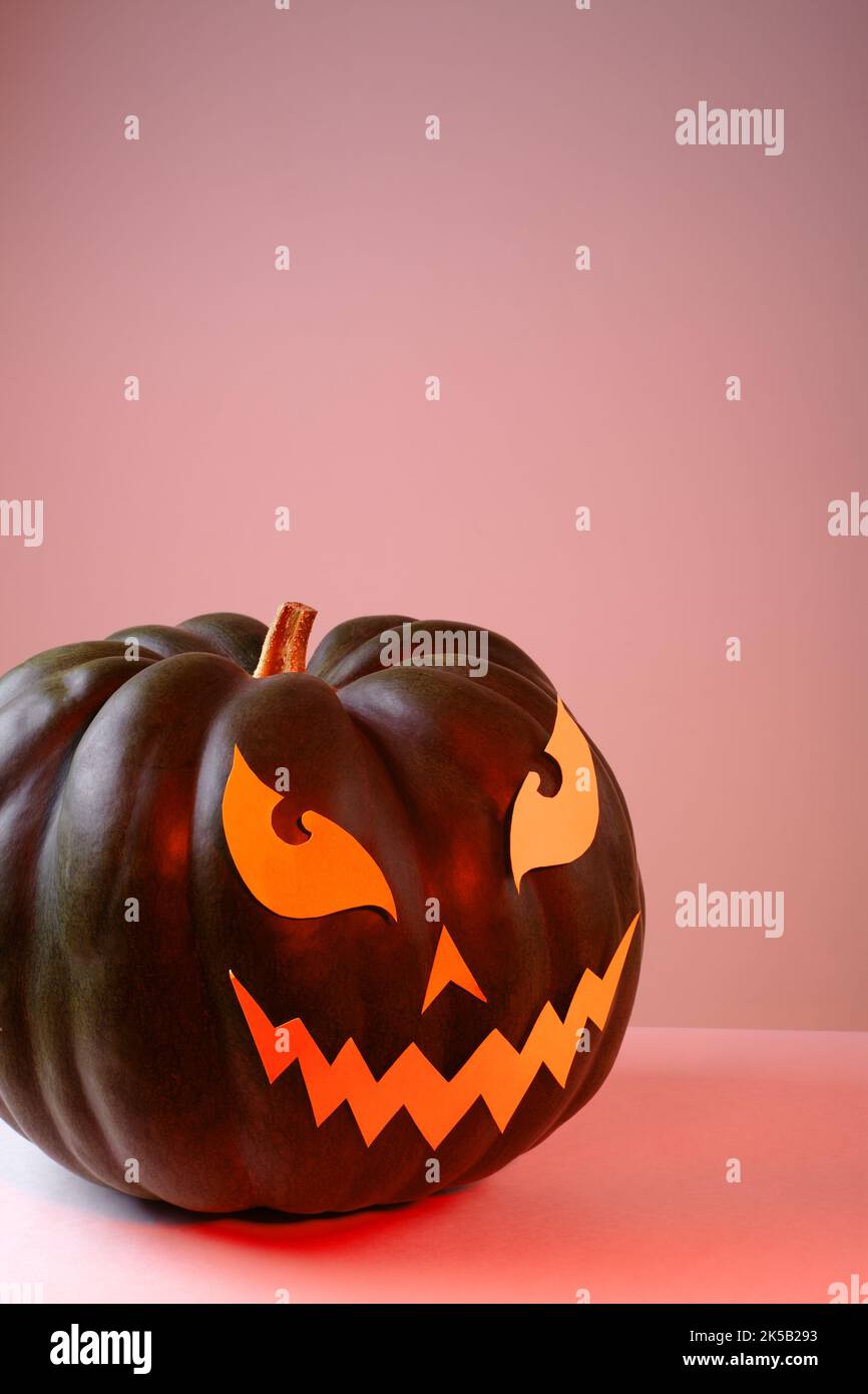 Halloween Pumpkin with Paper Cut Scary Face in Red Light. Jack ...
