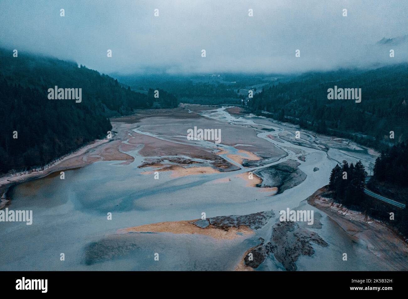 An aerial view of water area in Wiestalstausee reservoir covered in fog ...