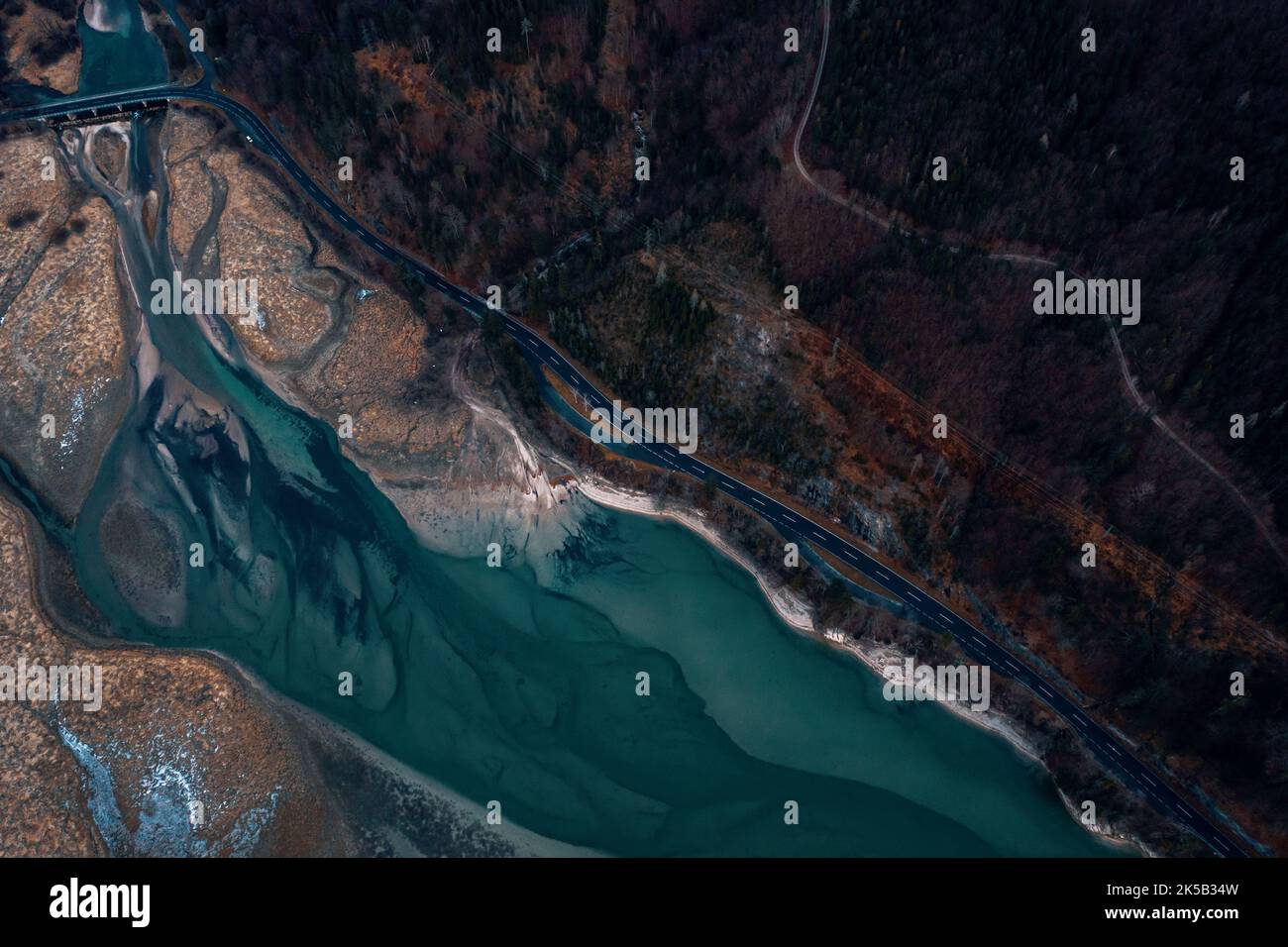 A breathtaking nature view of a blue crystal river under mountains from ...