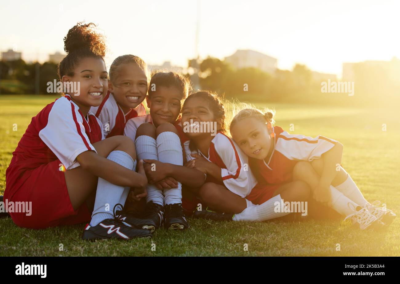 Girl kids, soccer field and team portrait together for competition ...