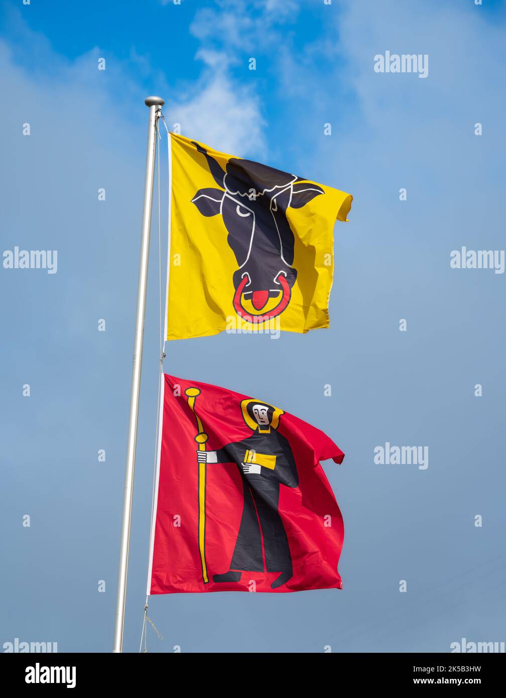 Cantonal flags at the border of cantons Uri (yellow flag) and Glarus ...