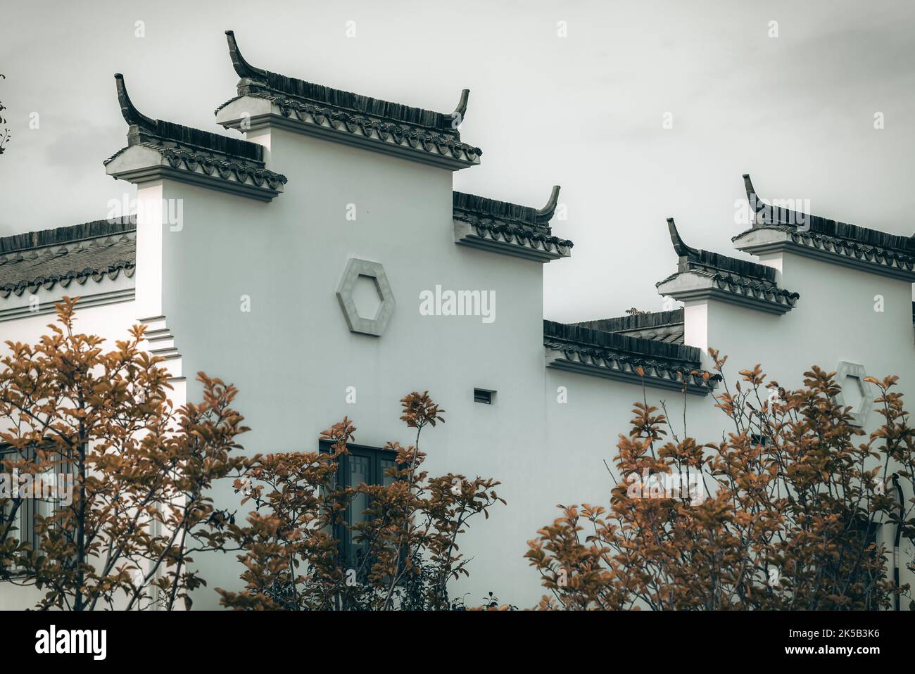 A white Asian style architecture building Stock Photo - Alamy