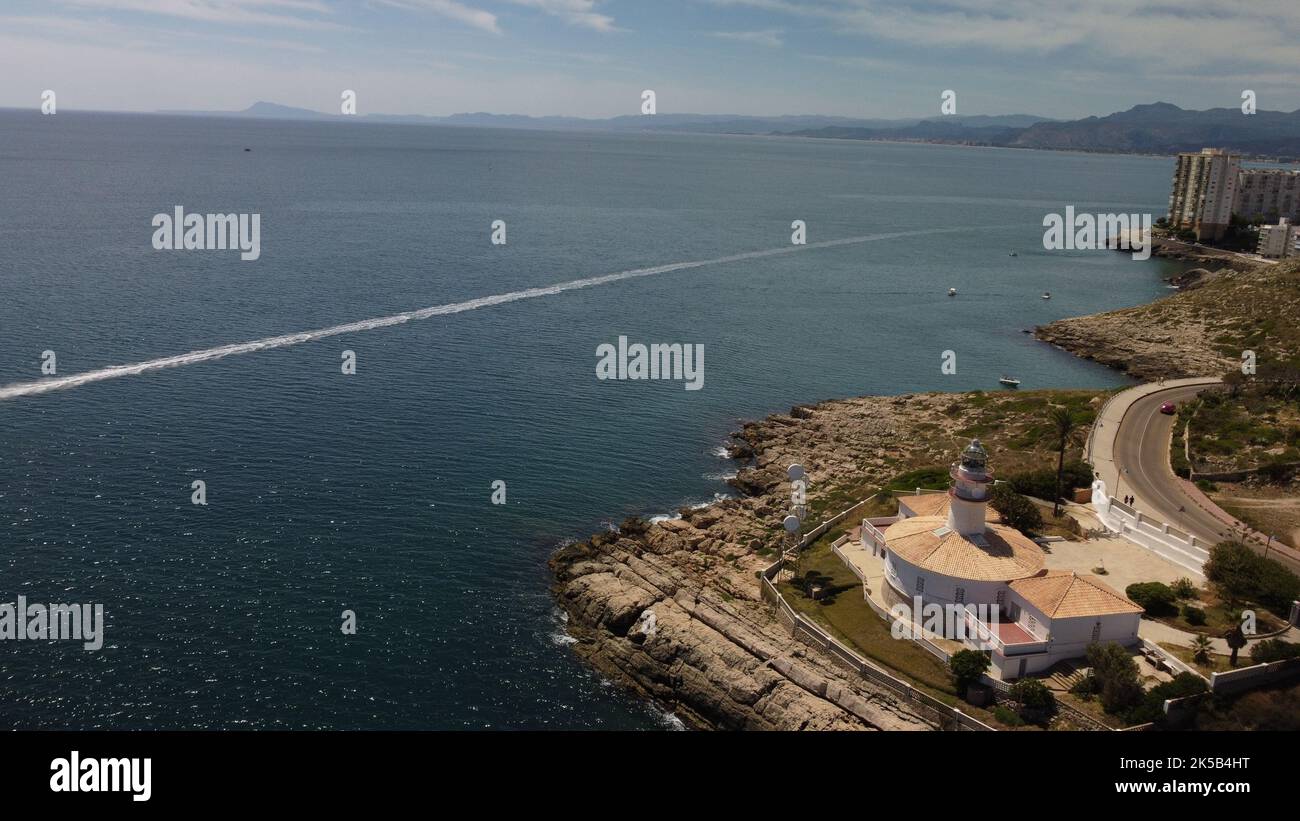 An aerial view of modern buildings of coastal Valencia and speedboat ...