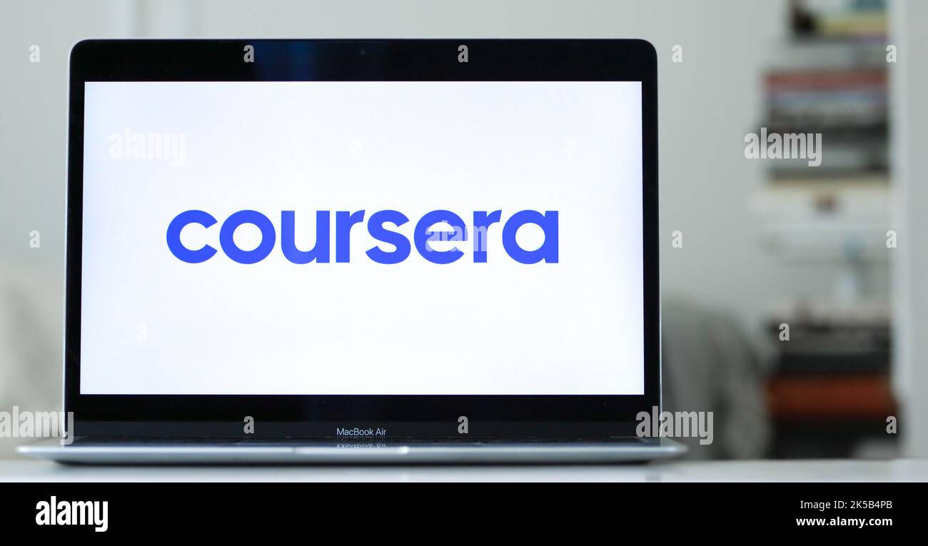 A laptop computer displaying the logo of Coursera - an online course ...