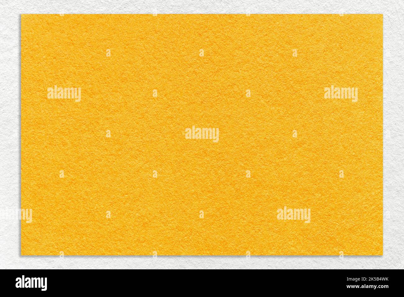 Texture of craft bright yellow color paper background with white border ...
