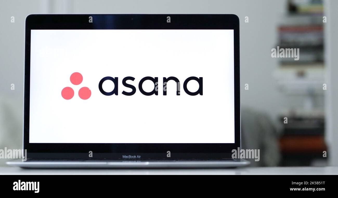 A laptop displaying the logo of Asana a web and mobile work management ...