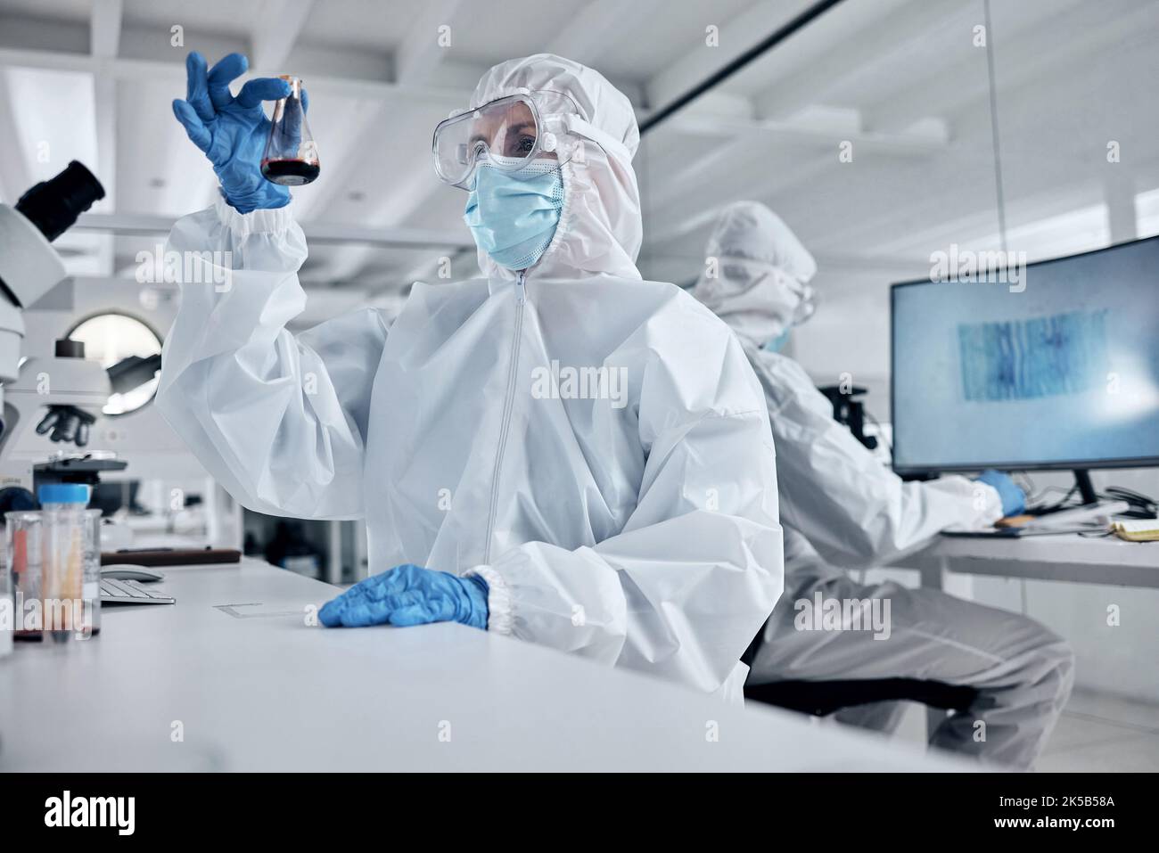 Blood, covid and doctors in a science laboratory testing dna and rna to ...