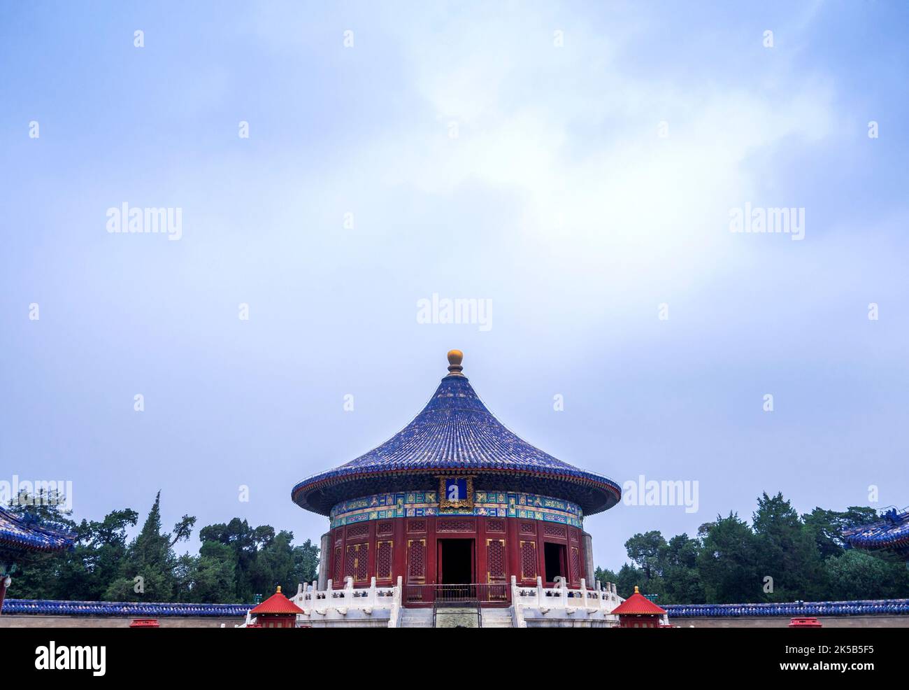 The top of an Asian architecture against blue cloudy sky Stock Photo ...