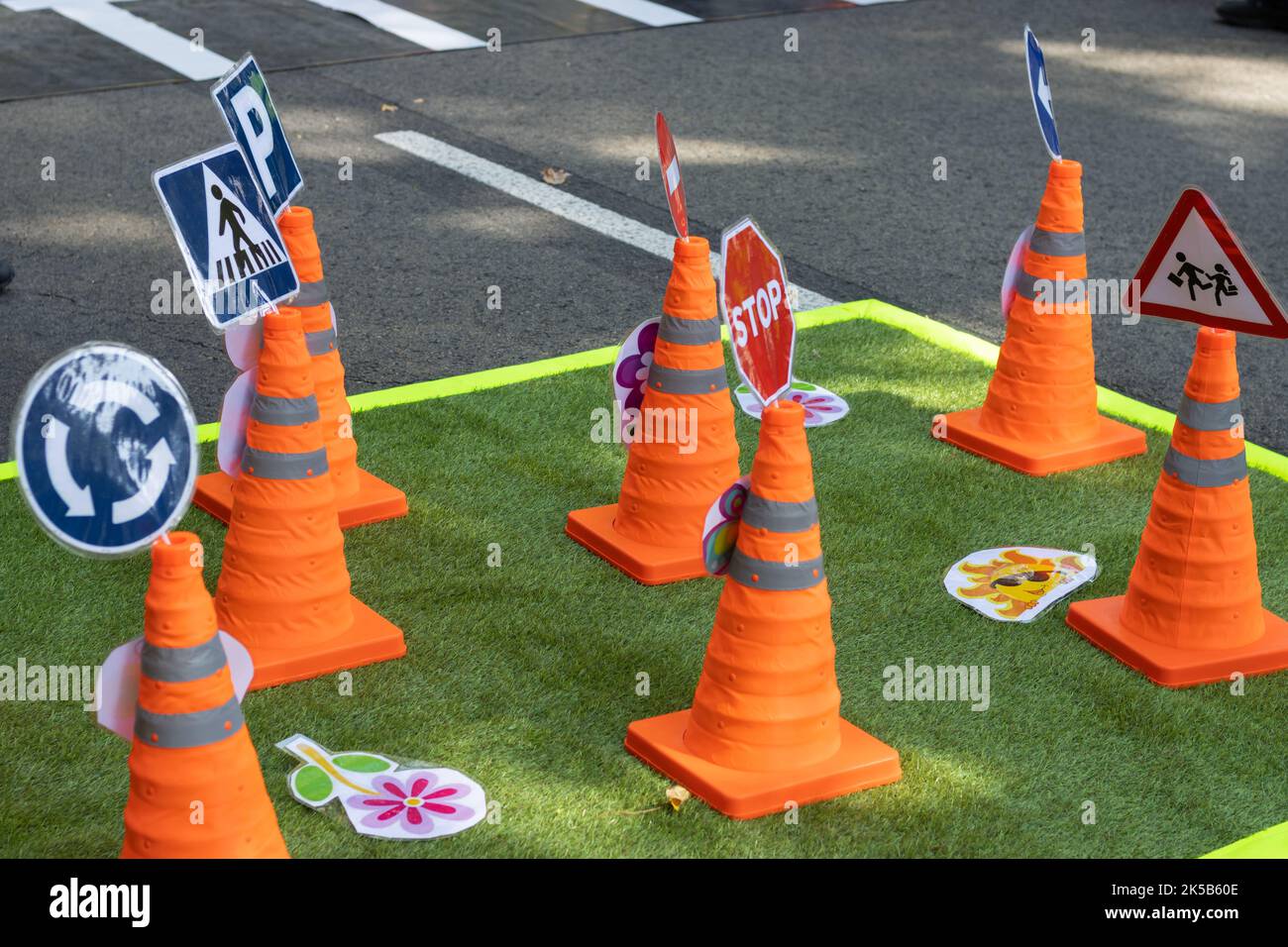 A closeup of toy traffic cones with traffic signs and symbols for ...