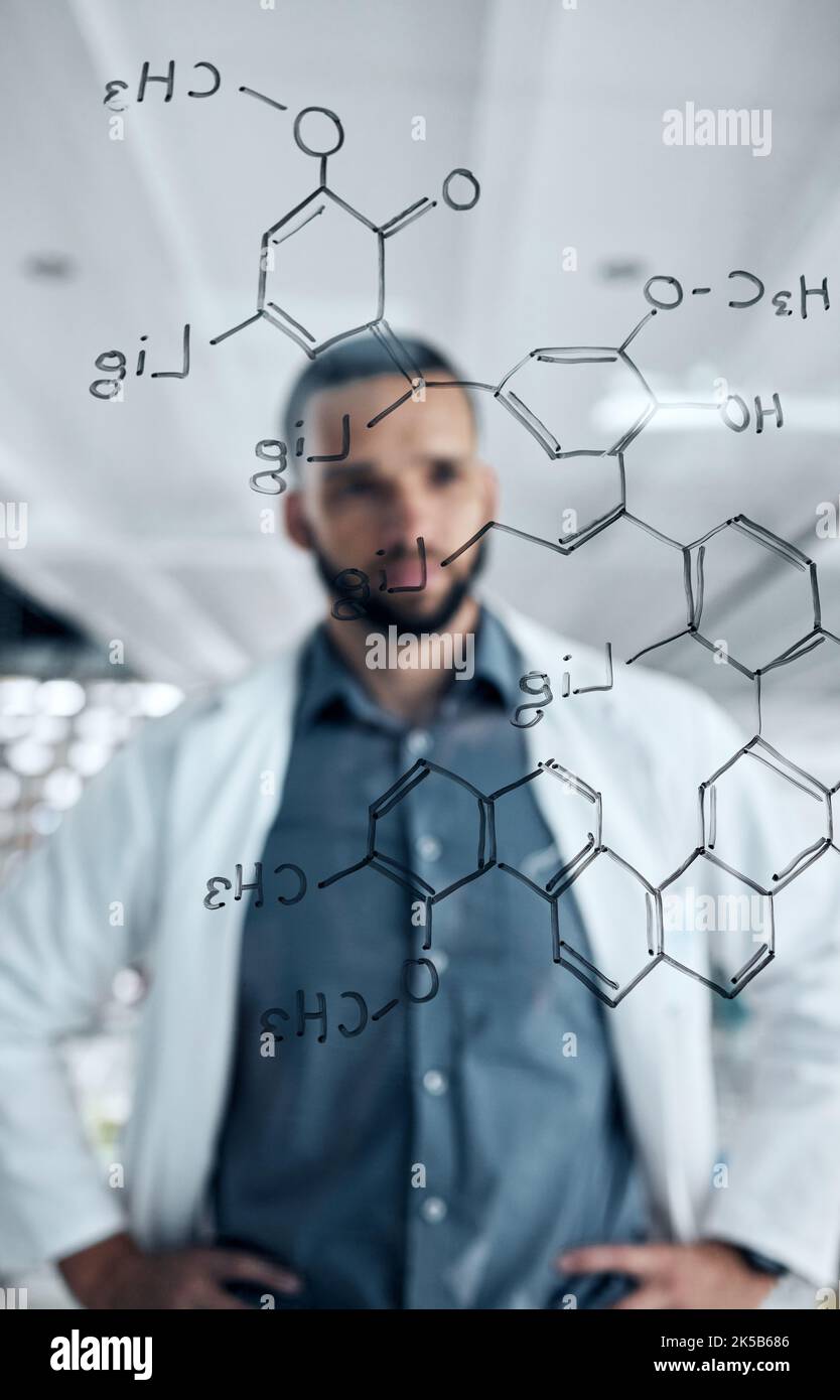 Chemistry man, glass wall and formula writing in science laboratory for ...
