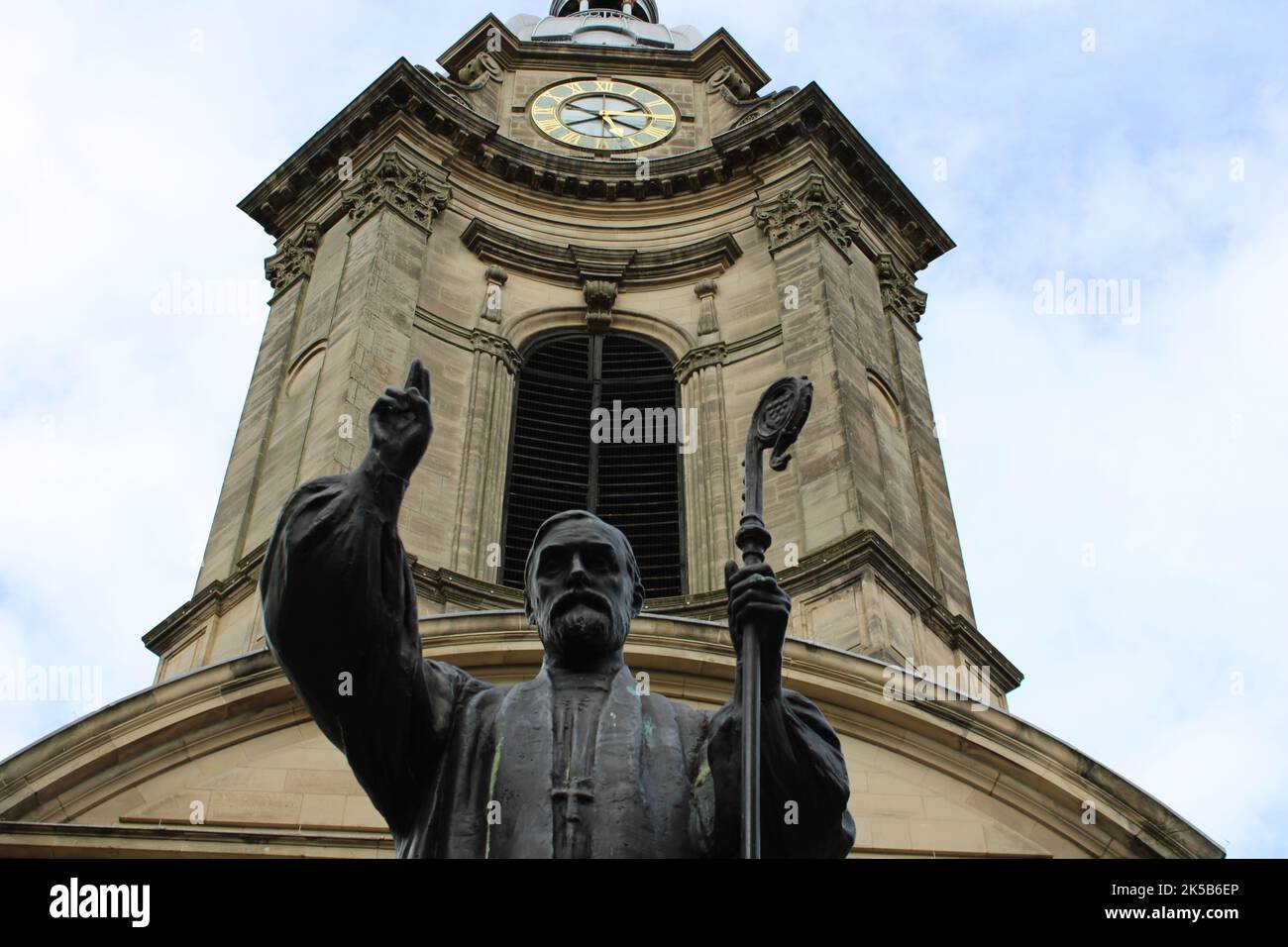 A low angle of Charles Gore statue in front of the St Philip's ...