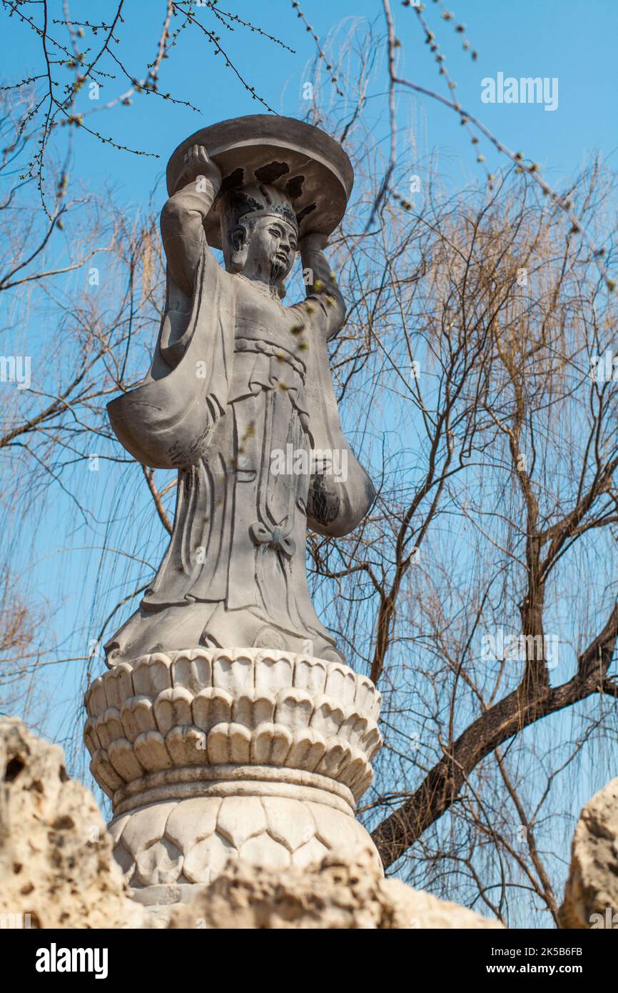 A vertical shot of a stone sculpture in Yuanmingyuan, the Imperial ...