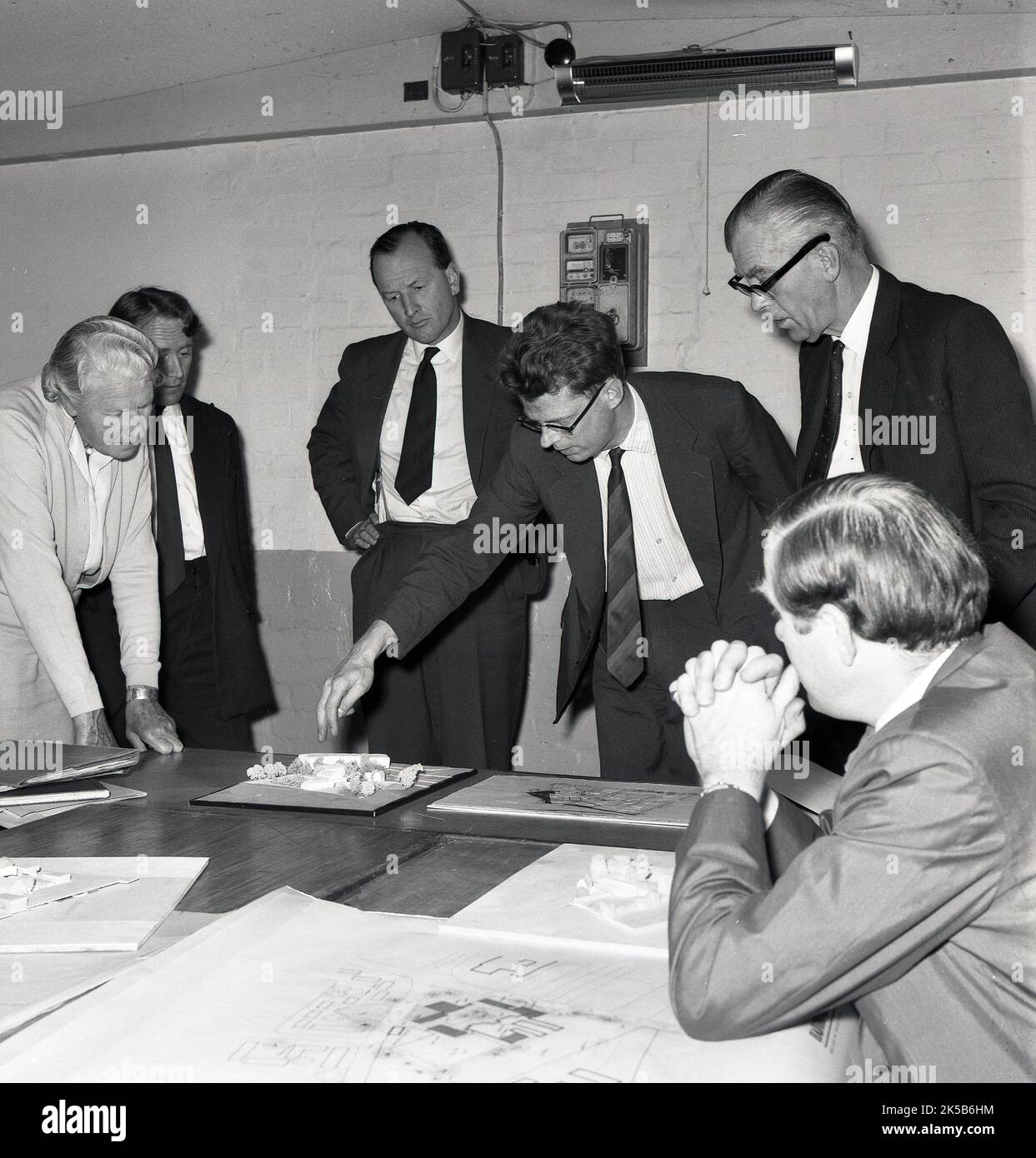 1960s, historical, inside a village hall, local parish councilors ...