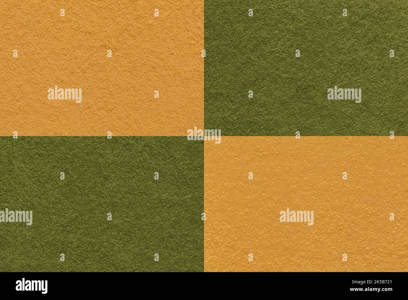 Texture of craft yellow and dark green paper background with cells ...