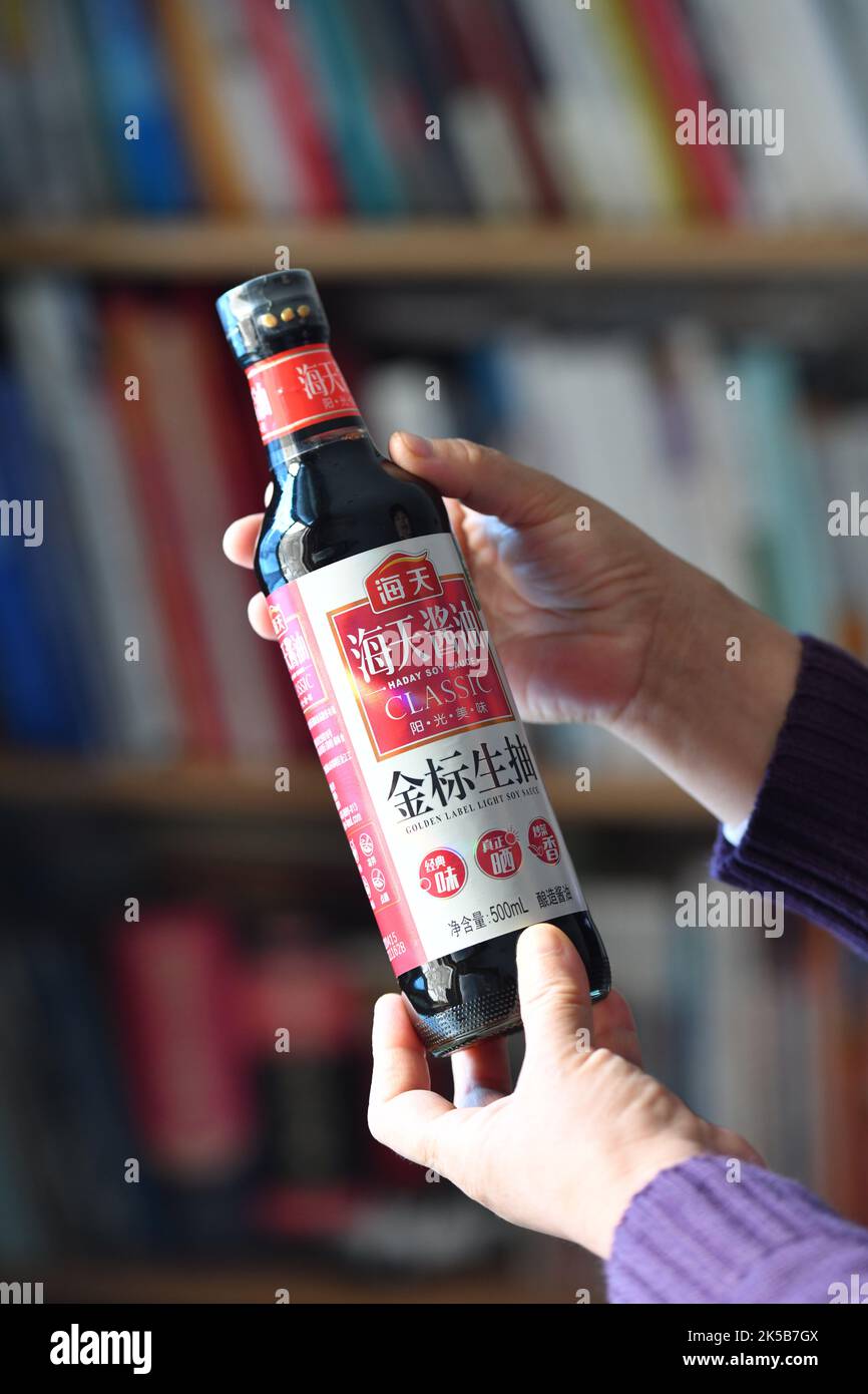 FUYANG, CHINA - OCTOBER 7, 2022 - A citizen checks Haitian soy sauce in ...