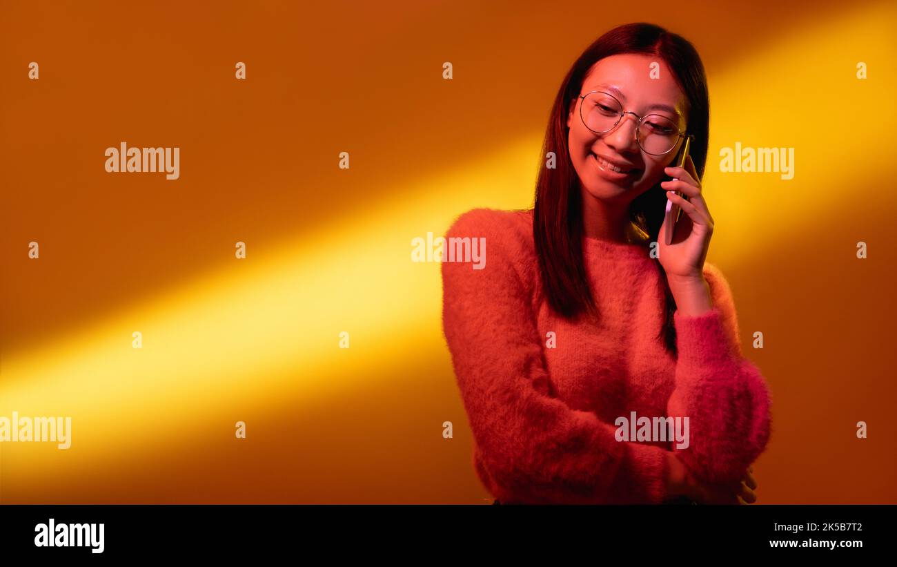 phone call color light banner neon woman on yellow Stock Photo - Alamy