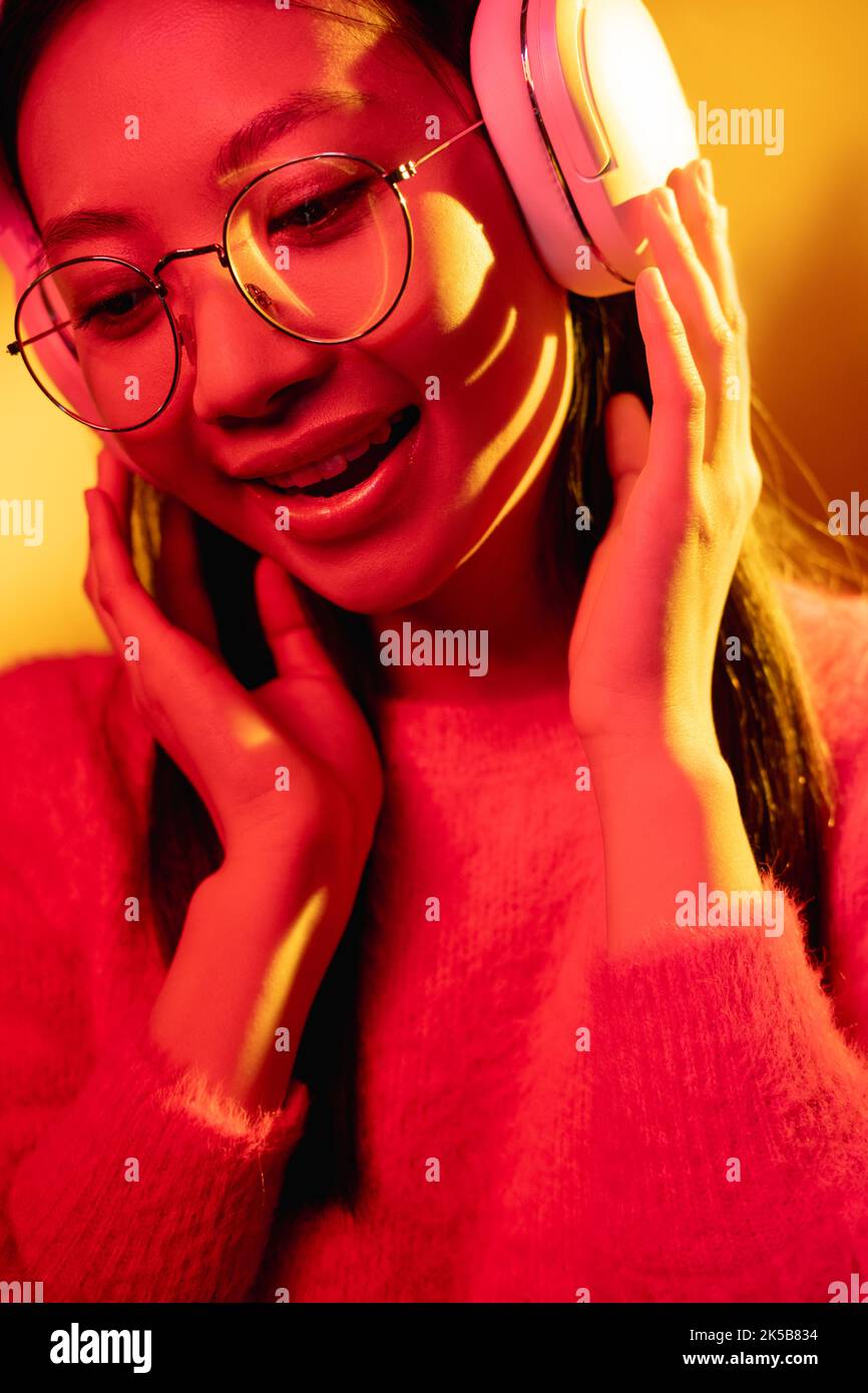 cyber music color light face dj girl in headphones Stock Photo - Alamy