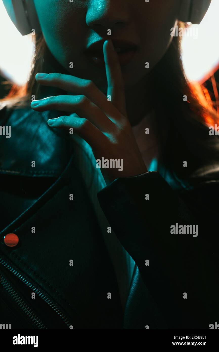 shush gesture cyberpunk people night neon girl shh Stock Photo - Alamy