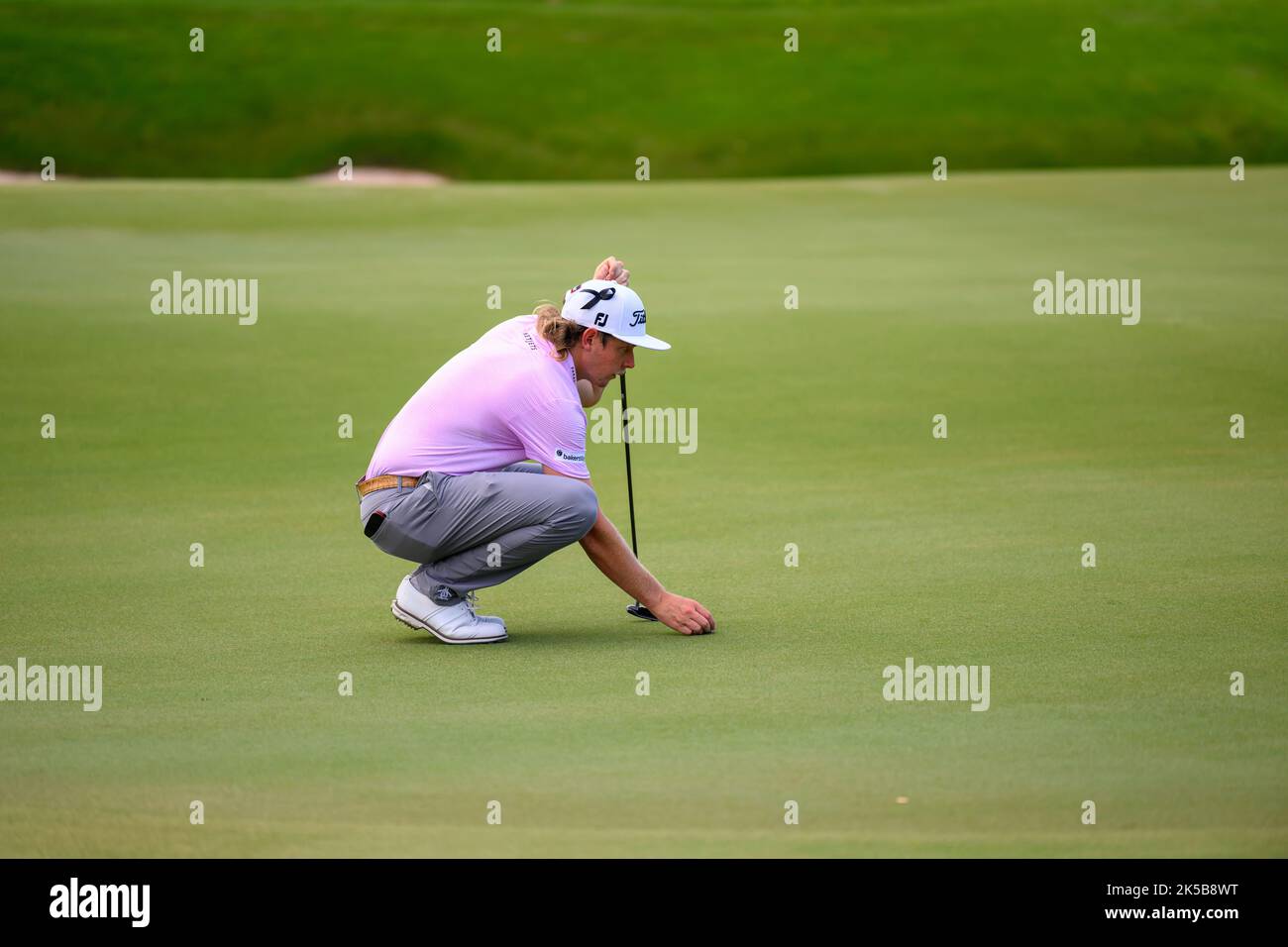 Cameron Smith of Australia putts on hole 4 during the 1st round of the ...