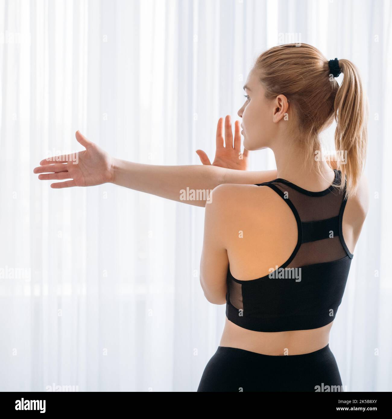 morning exercise home fitness woman stretching arm Stock Photo - Alamy