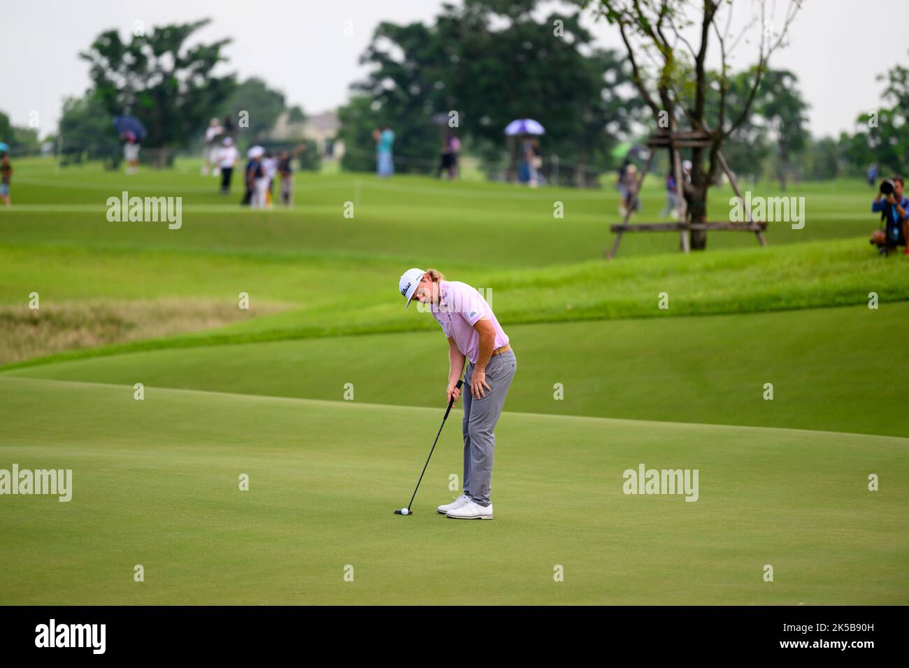 Cameron Smith of Australia putts on hole 4 during the 1st round of the ...