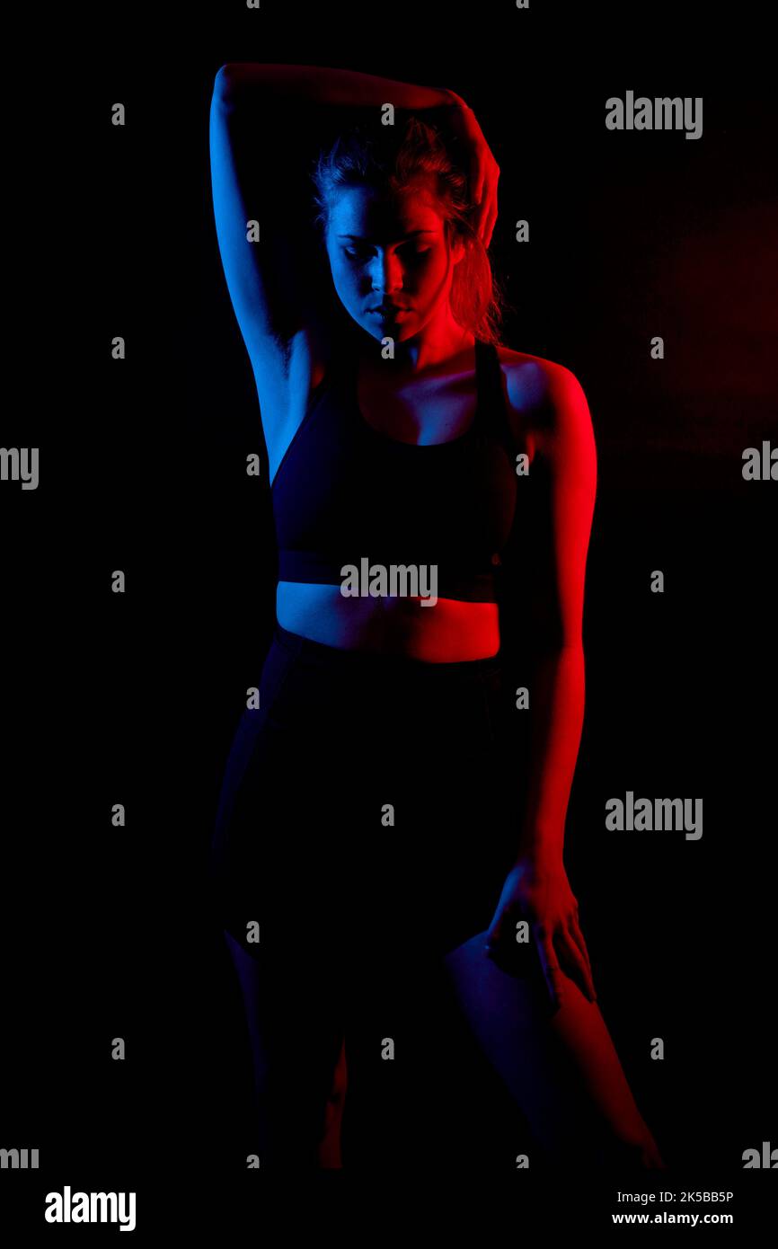 Female model with fitness outfit inside studio Stock Photo - Alamy