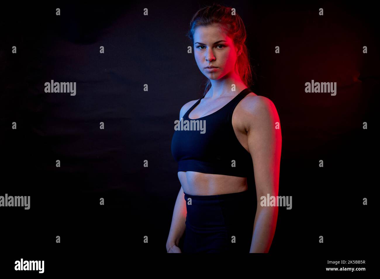 Female model with fitness outfit inside studio Stock Photo - Alamy
