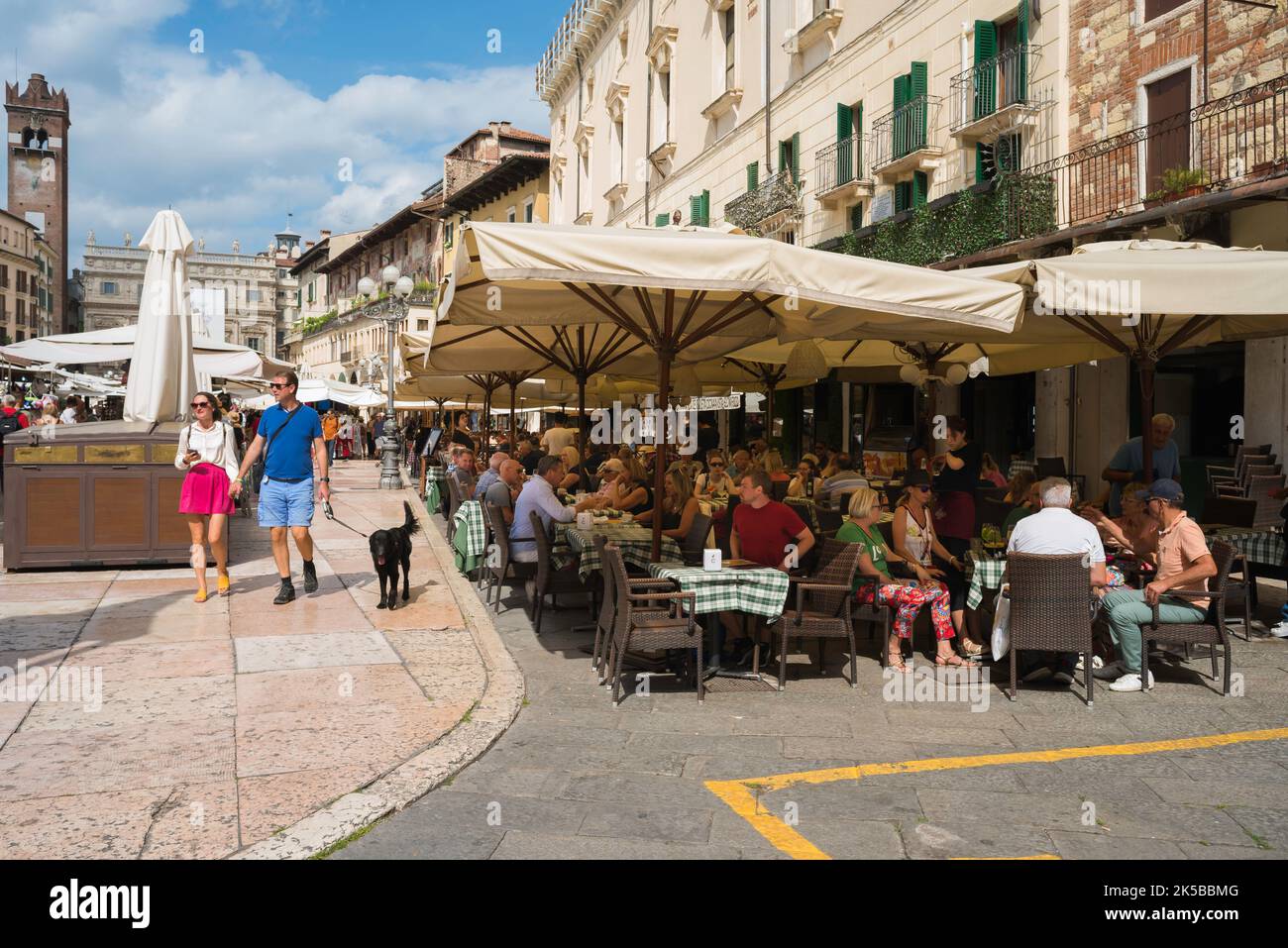 Piazza delle Erbe, view in summer of people seated outside cafes and ...
