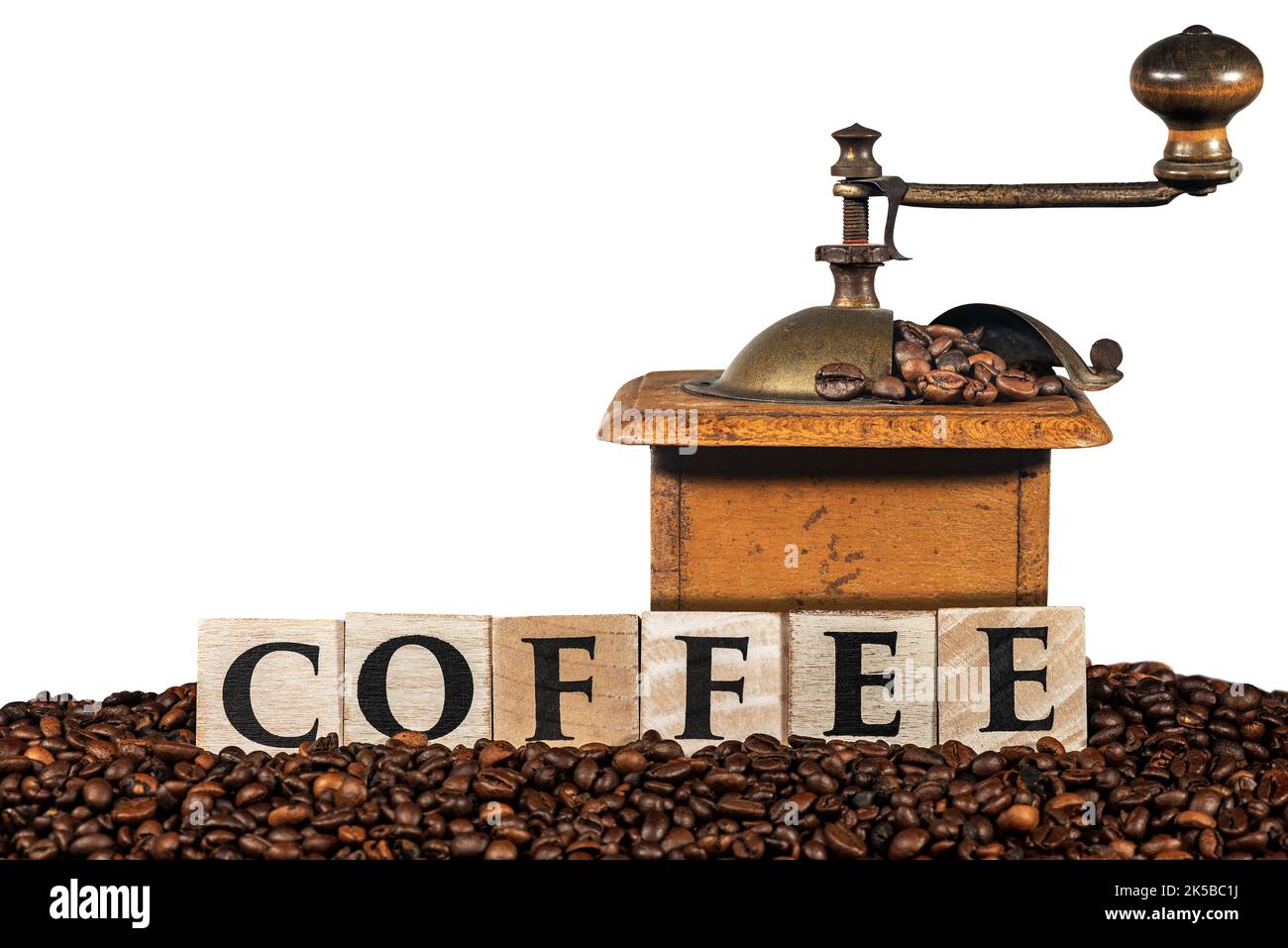 Old manual coffee grinder with roasted coffee beans and the text Coffee ...
