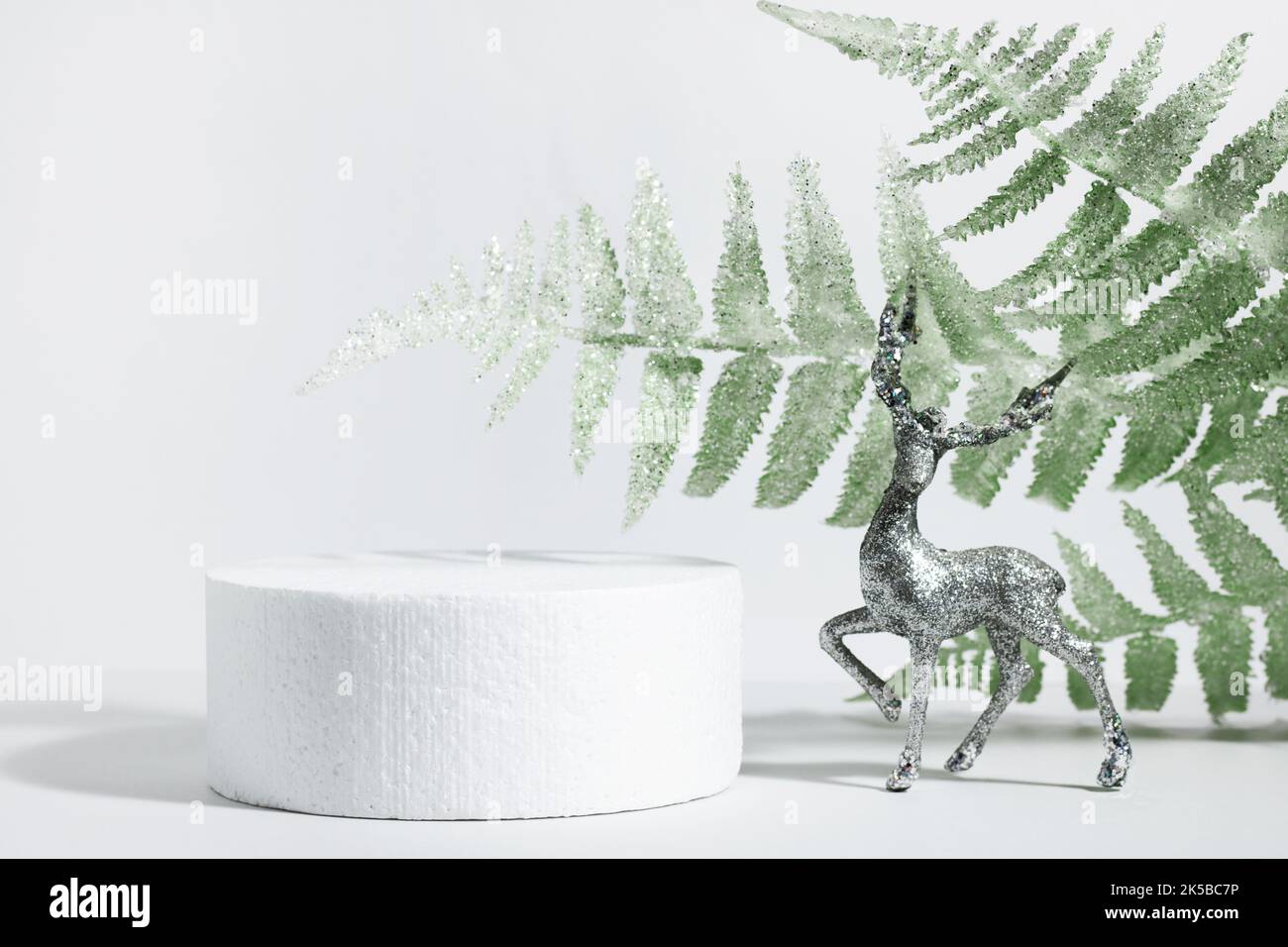 White podium leaves green on hi-res stock photography and images - Alamy