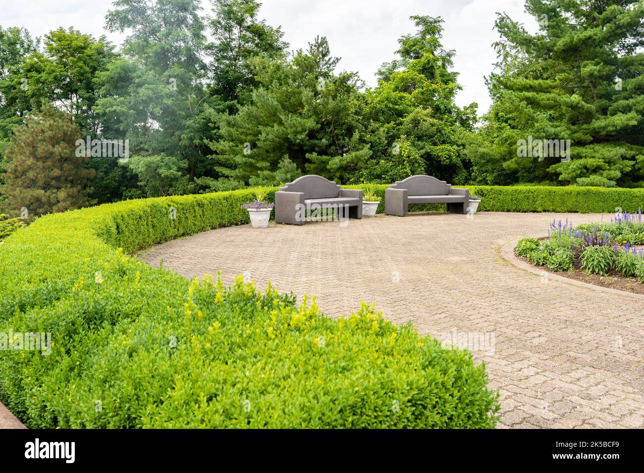 A closeup shot of grey benches in the garden on a sunny day Stock Photo ...