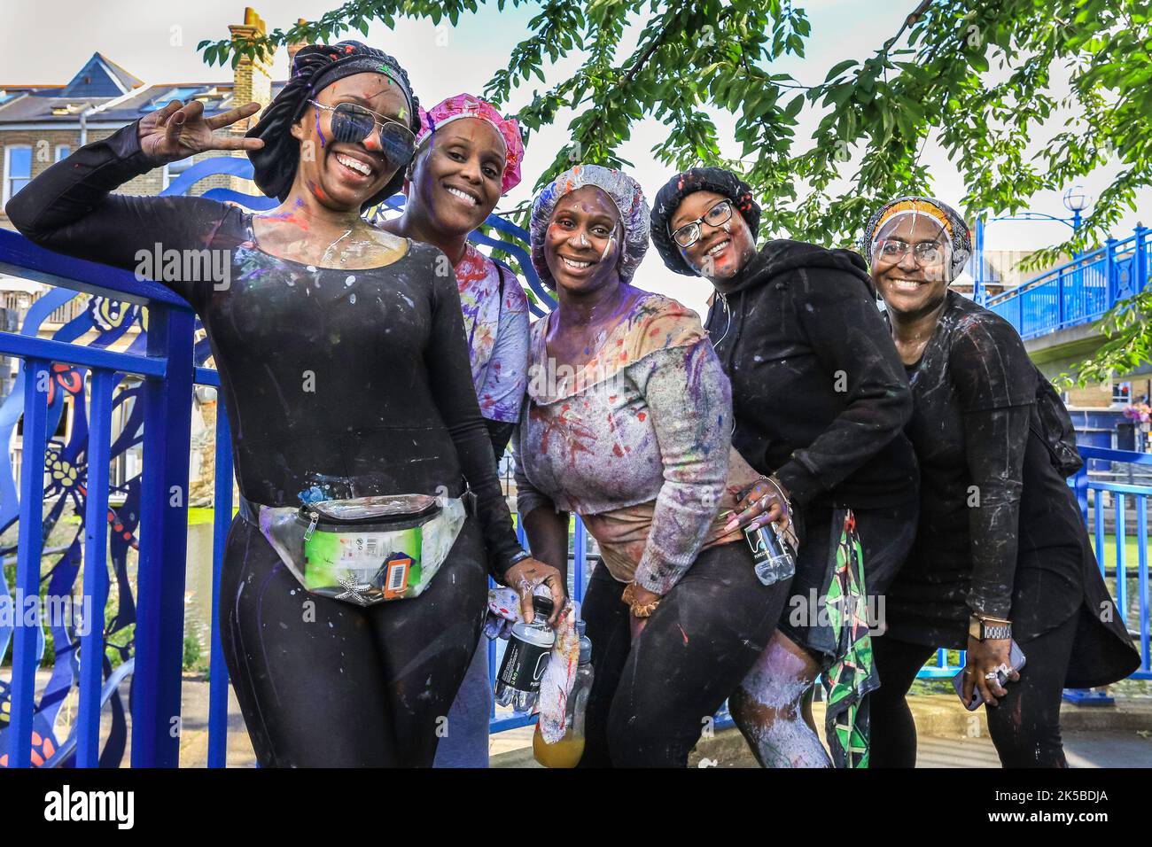 A group of women have fun at the early morning J'ouvert celebration ...