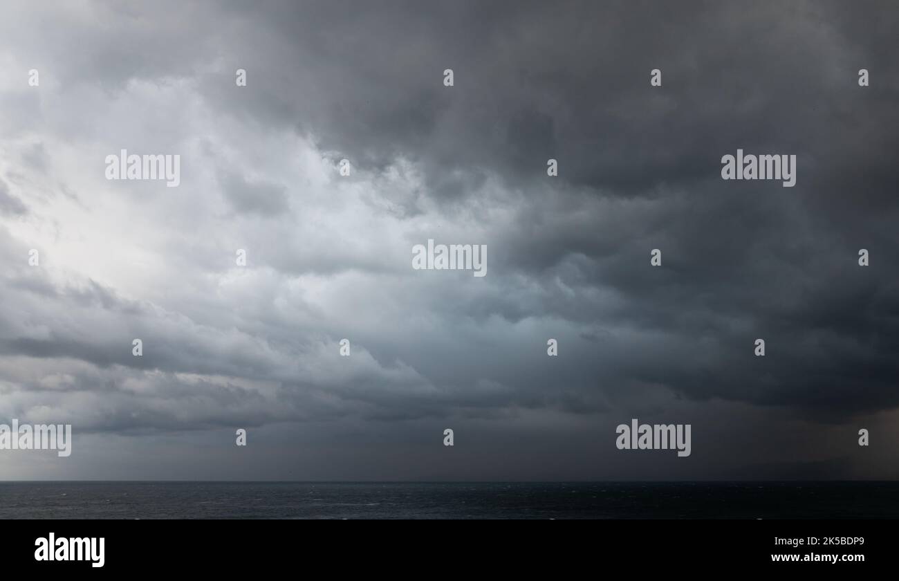 Dramatic dark stormy sky over sea water, natural photo background Stock ...