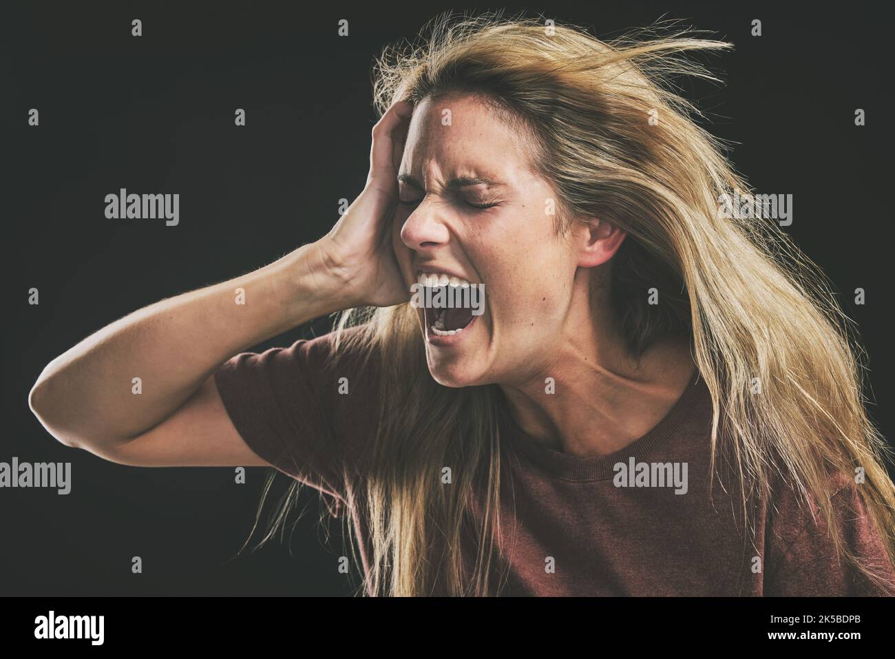 Anxiety, frustrated and trauma woman crying in dark studio for ...