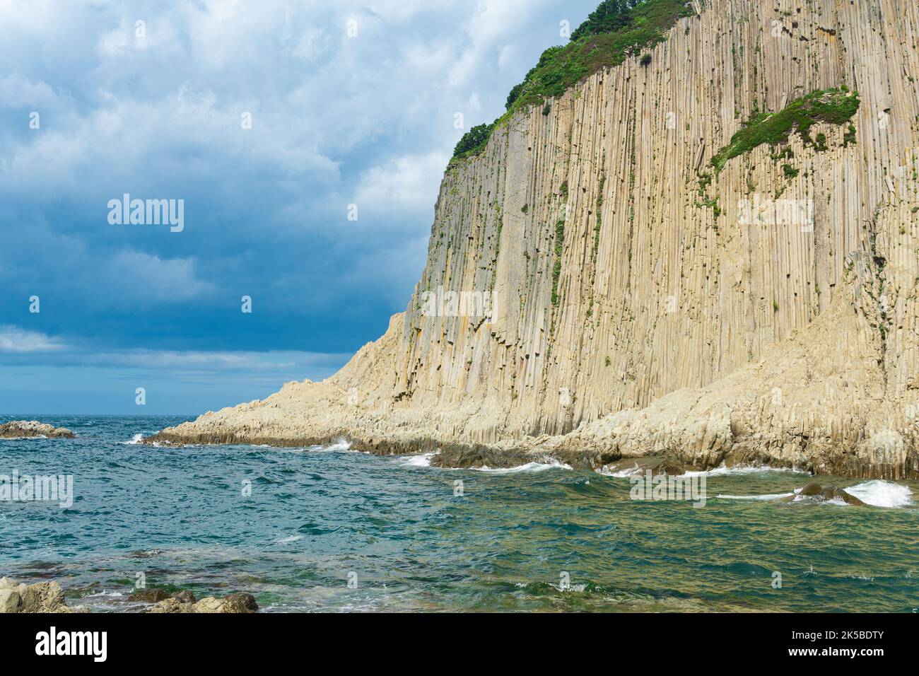 coast of Kunashir Island with columnar basalt cliff, Cape Stolbchaty ...
