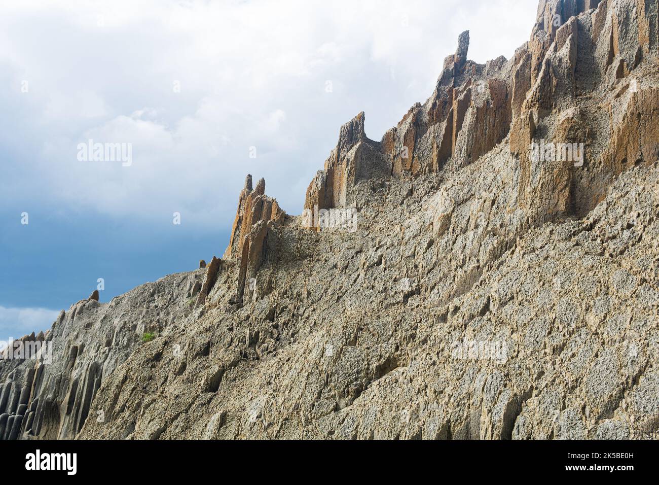 majestic rocks from volcanic columnar basalt against the sky, natural ...