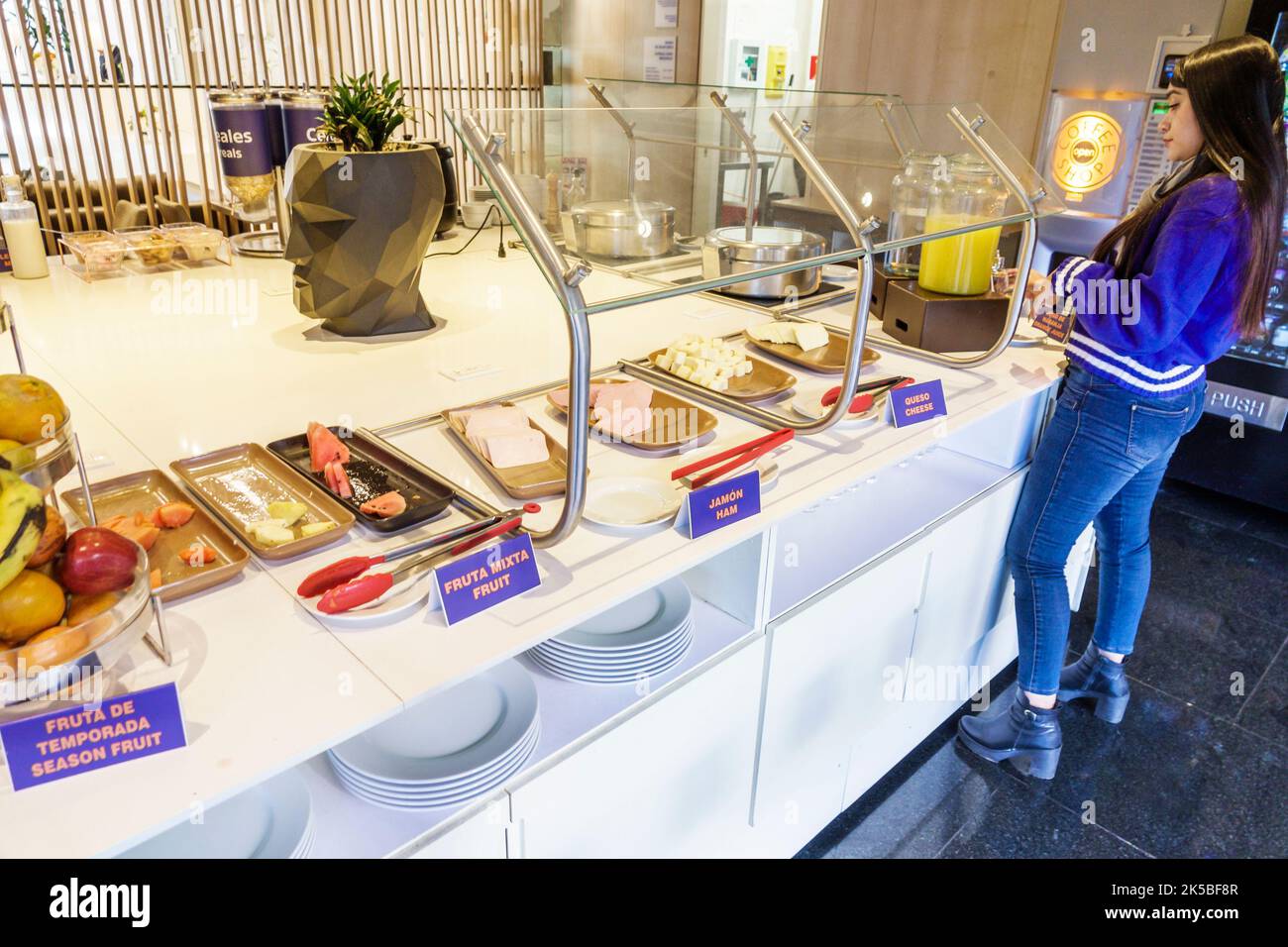 Woman women female self serve service buffet table bar hi-res stock ...