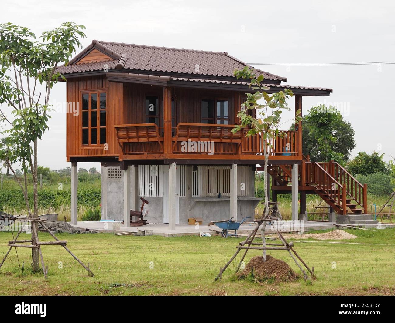 A Khmer traditional wooden house surrounded by green vegetation Stock ...